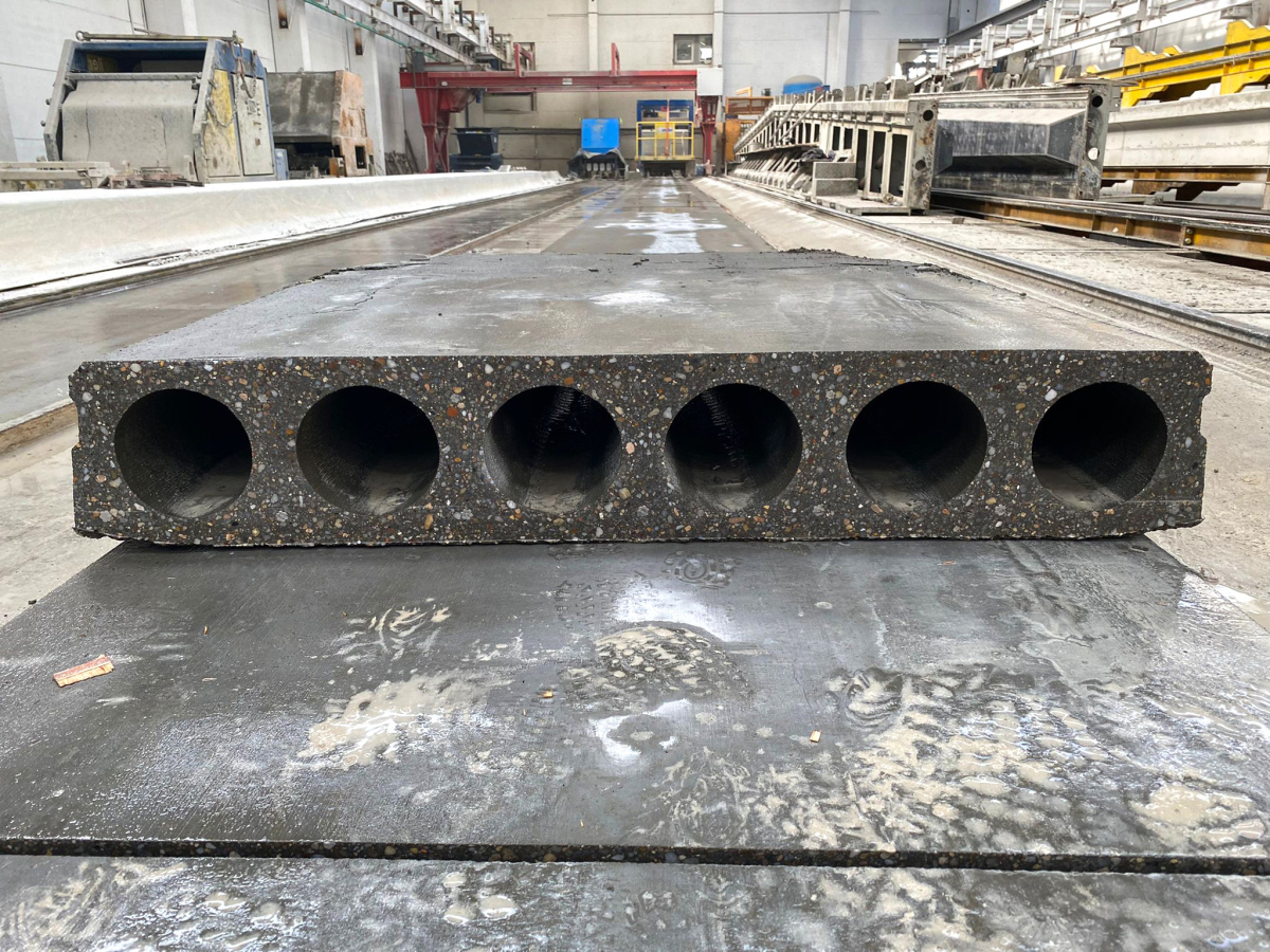 Continuous production automation of high compacted hollow core slabs ...