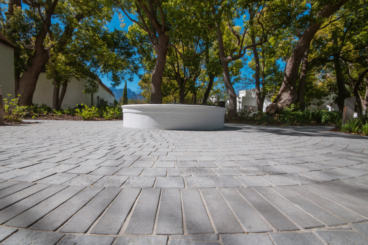 Cast stone cobbles frame eye-catching paving network - Concrete Plant ...